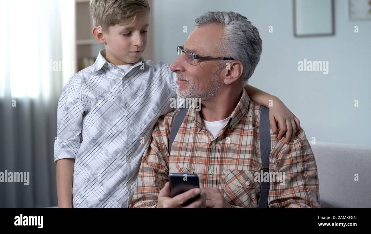 Boy with old man hi-res stock photography and images - Alamy