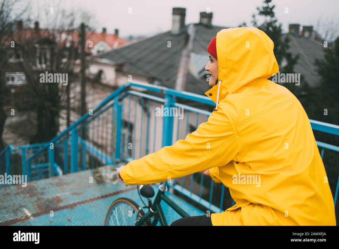 Person cycling in rain hi-res stock photography and images - Alamy