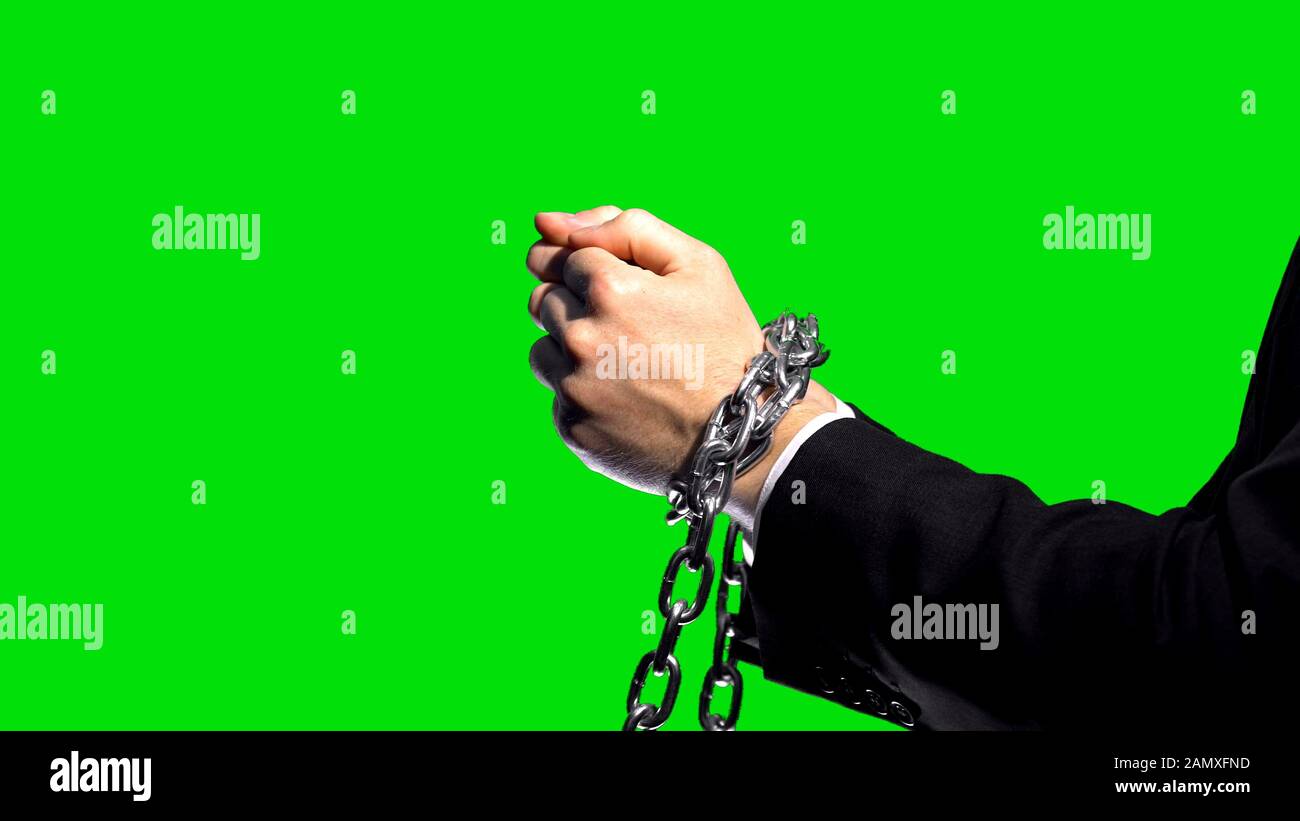 Business sanctions, chained arms on green screen background, economic ...