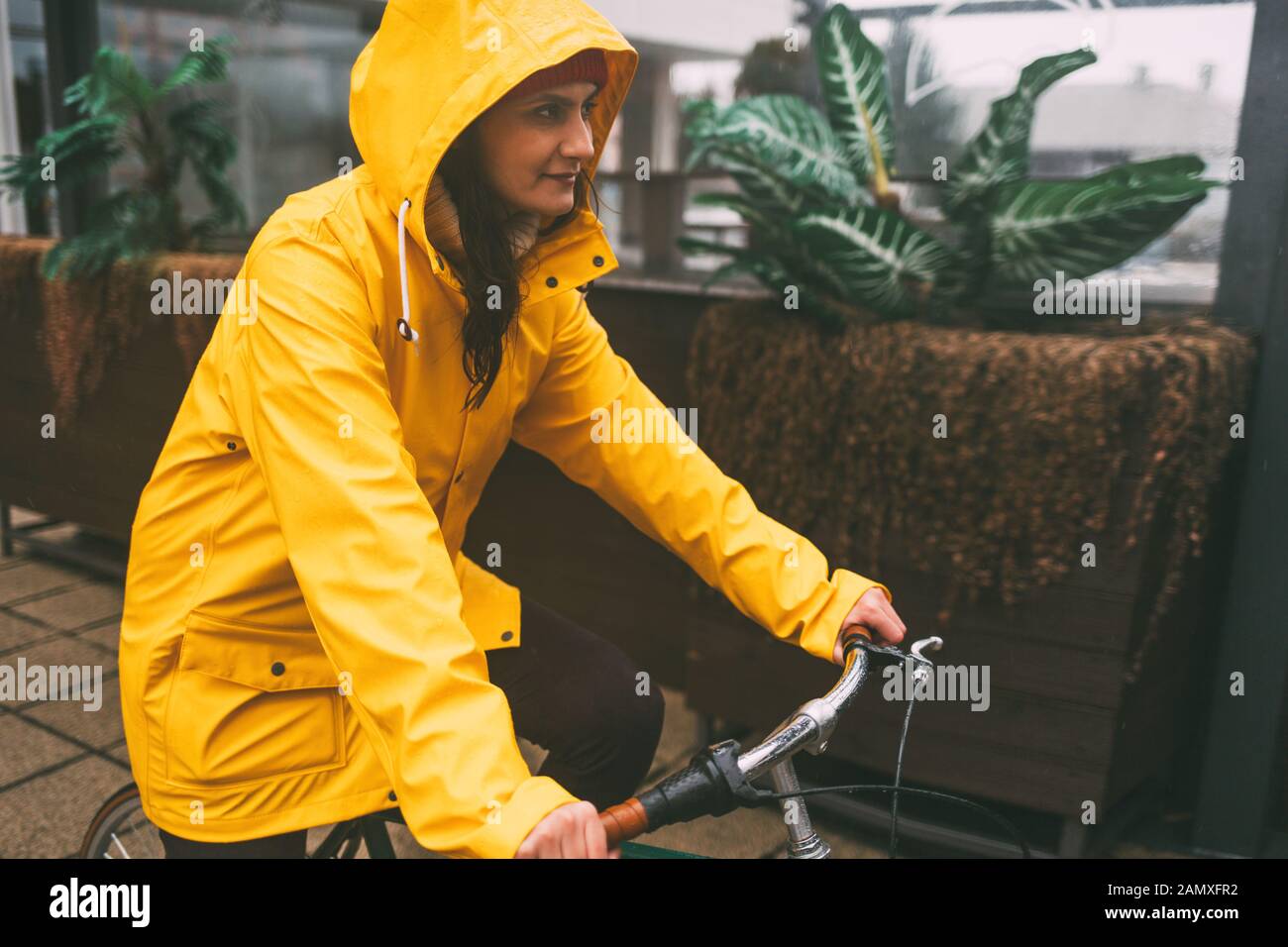 Cycling rain woman hi-res stock photography and images - Alamy