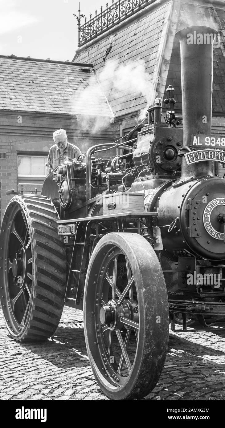 Black and white front view close up of vintage UK steam traction engine ...