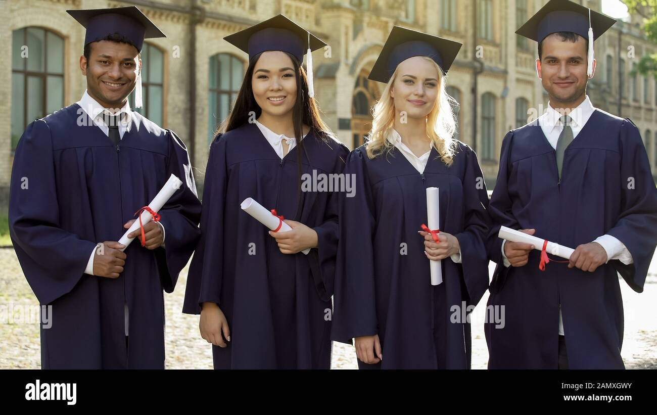 Happy graduates celebrating academic hi-res stock photography and ...