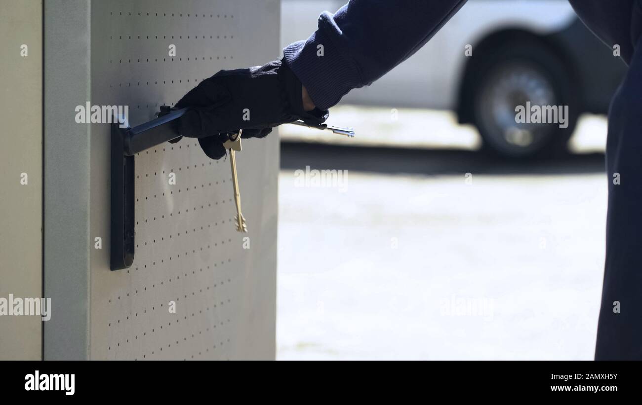 Bank employee opening ATM safe with keys to load storage with cash ...