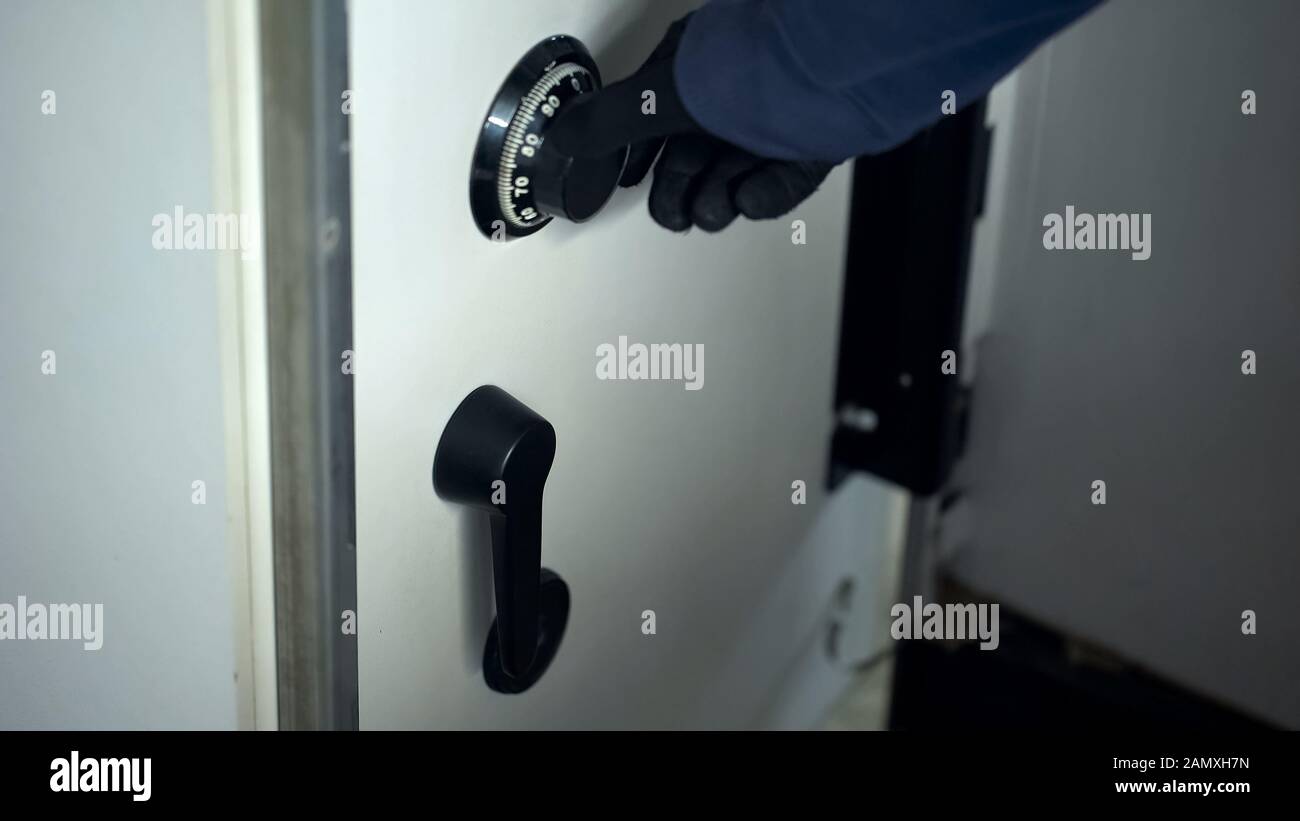 Person unlocking safe in bank hi-res stock photography and images - Alamy