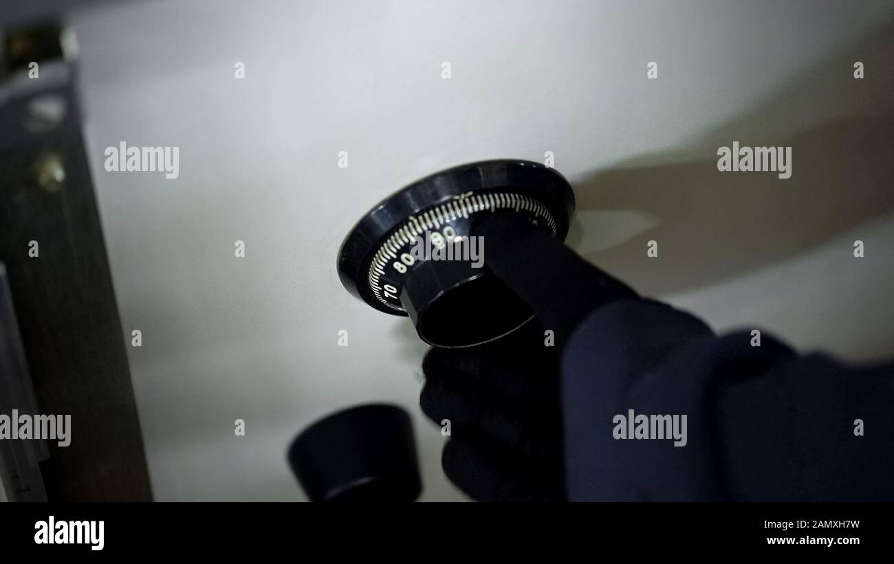 Person unlocking safe in bank hi-res stock photography and images - Alamy