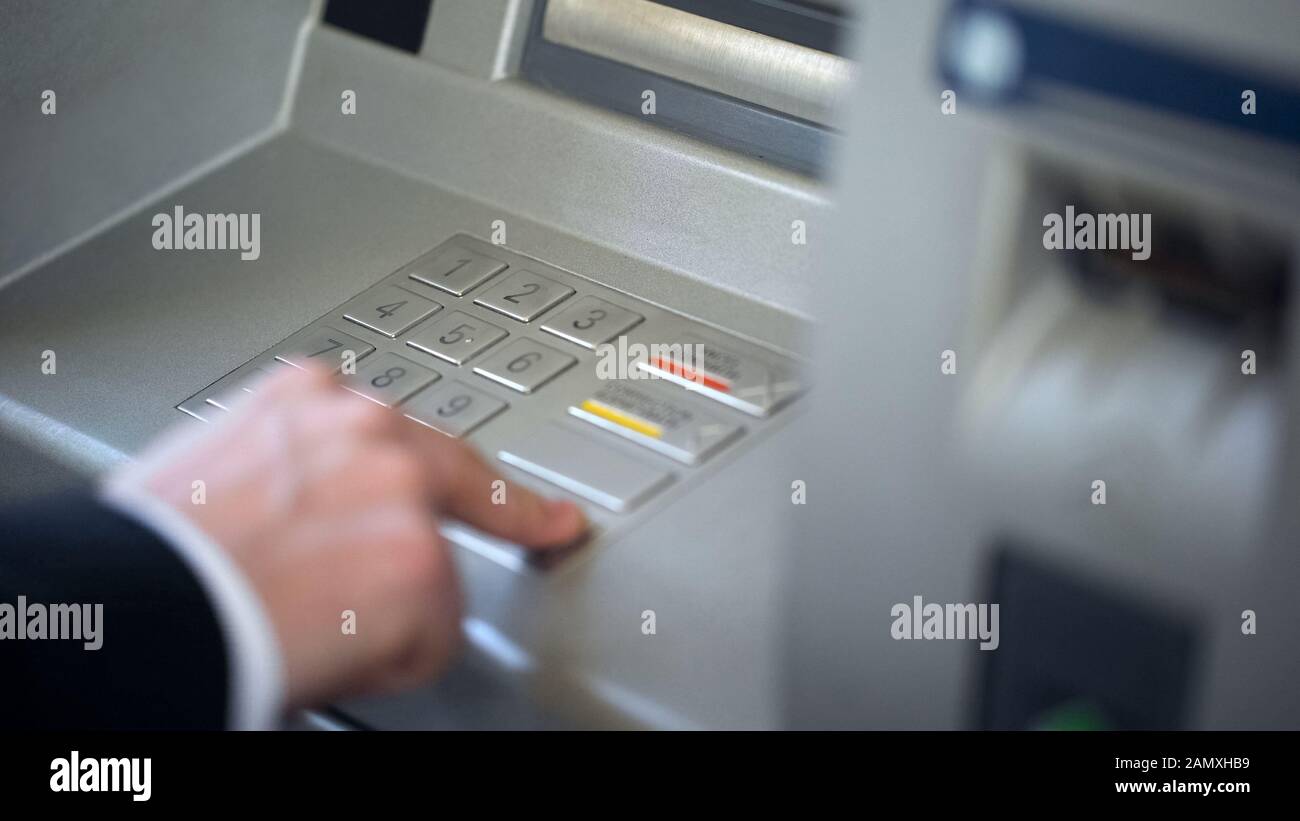 Person entering pin atm hi-res stock photography and images - Alamy