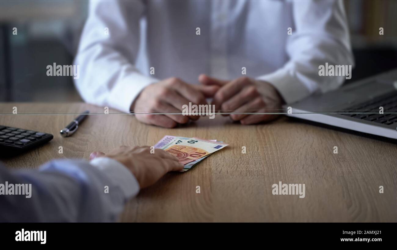 Bank client giving euros to bank clerk, money exchange service, foreign ...