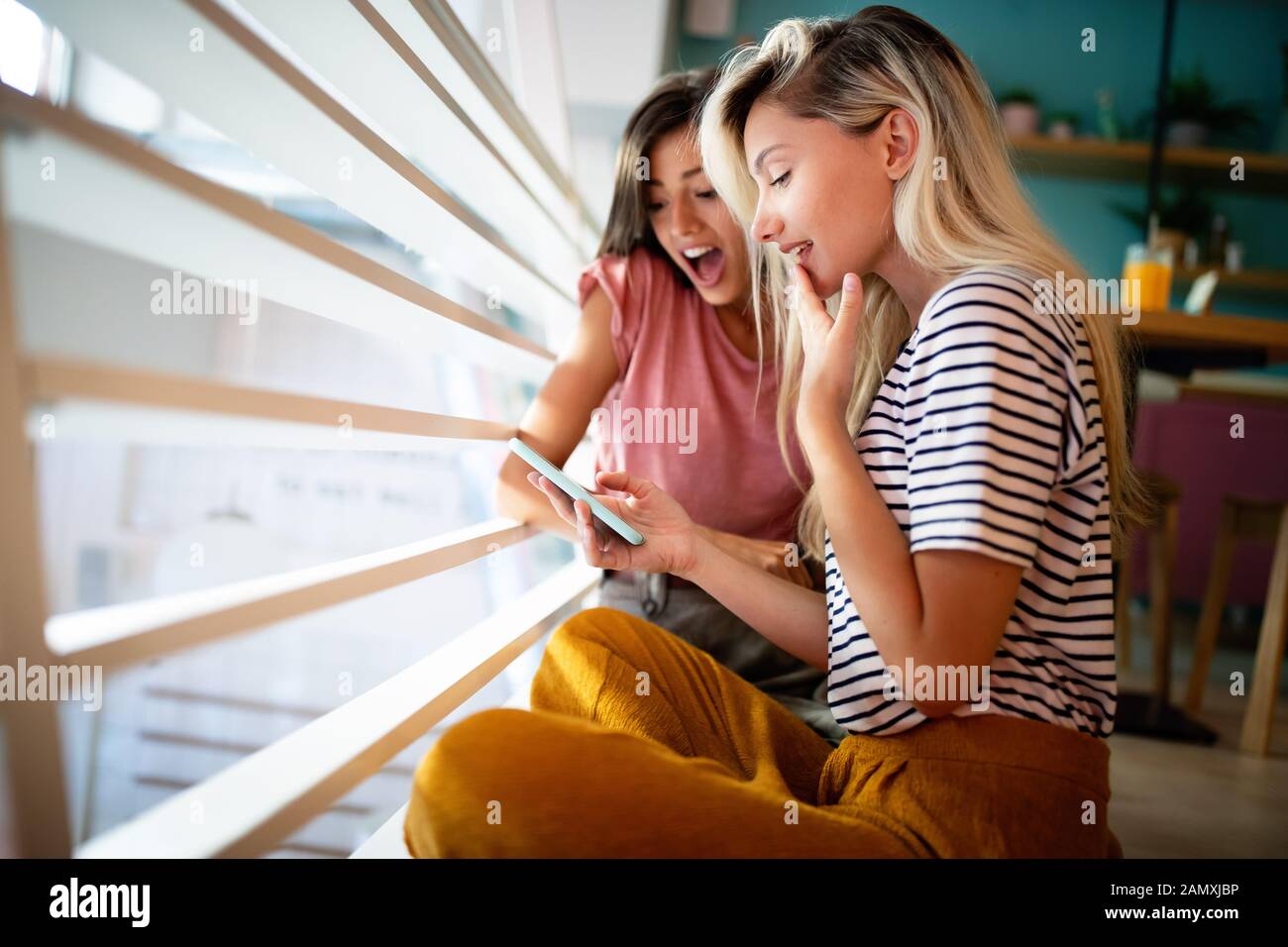 Happy beautiful women friends having fun, talking and smiling Stock ...