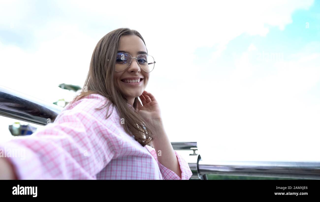 Beautiful girl posing for camera, vlog on roof, blogger traveling ...