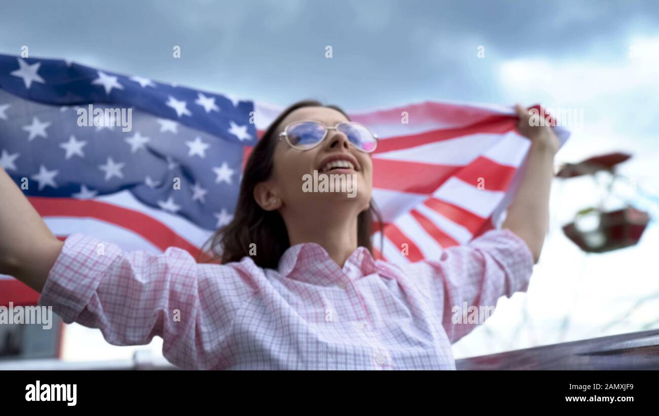 USA fan cheering and waving American flag at stadium, supporting ...
