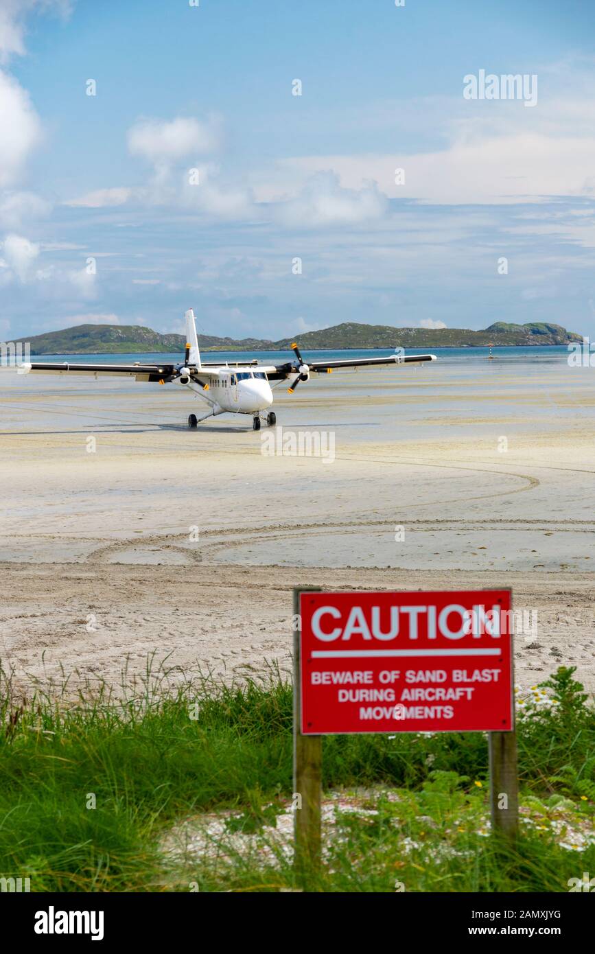 The unique sand runway at the airport on the beach on the Isle of Barra ...