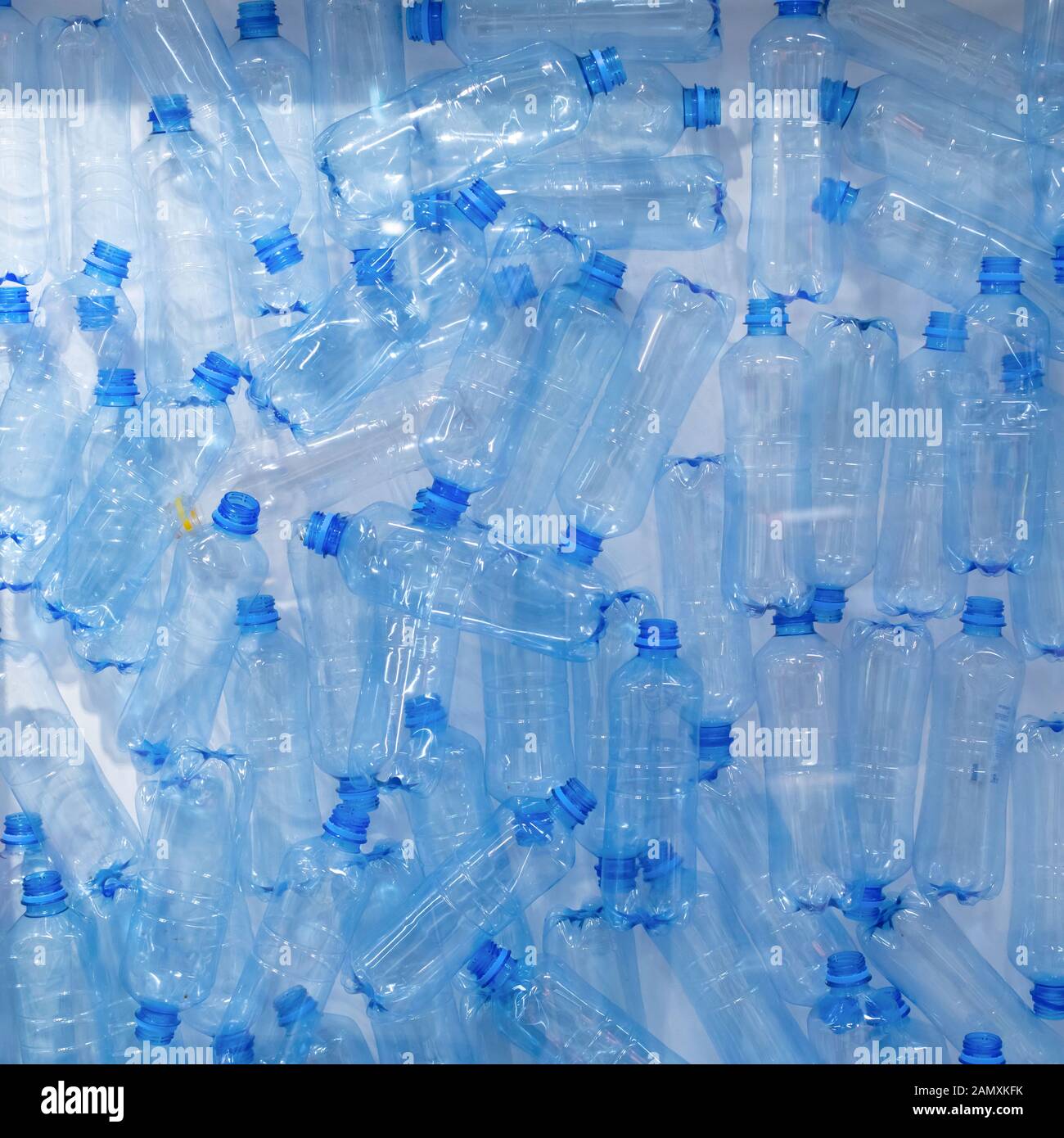 Blue plastic bottles, separate collection of garbage background ...