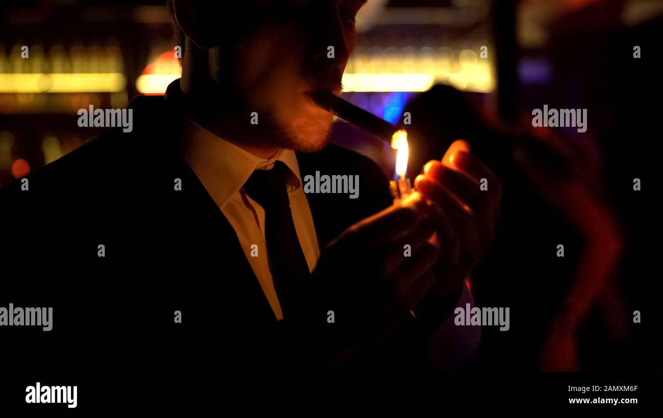 Lighting cigar hi-res stock photography and images - Alamy