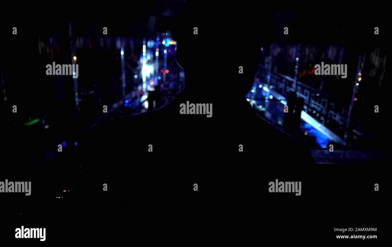 Back view of dj working with sound equipment during performance in ...