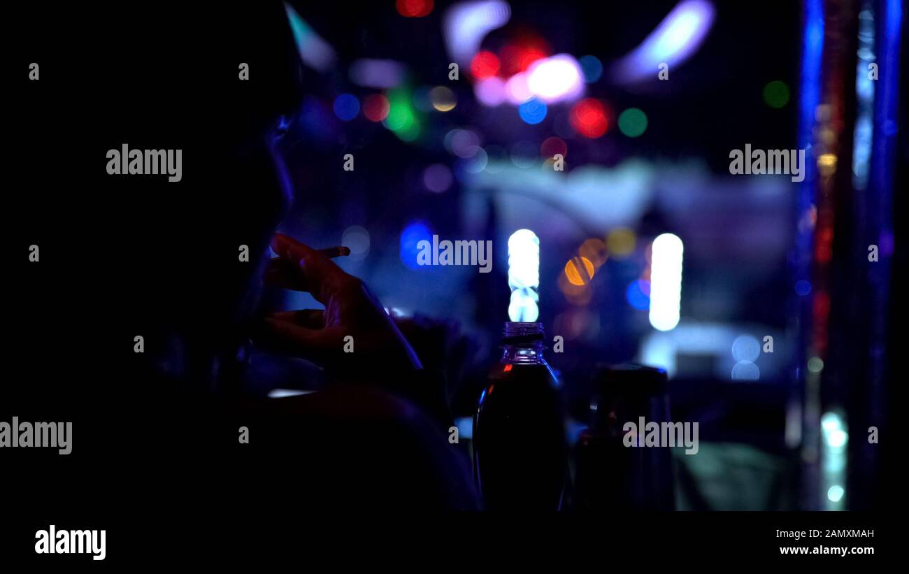 Brunette smoking cigarette hi-res stock photography and images - Alamy