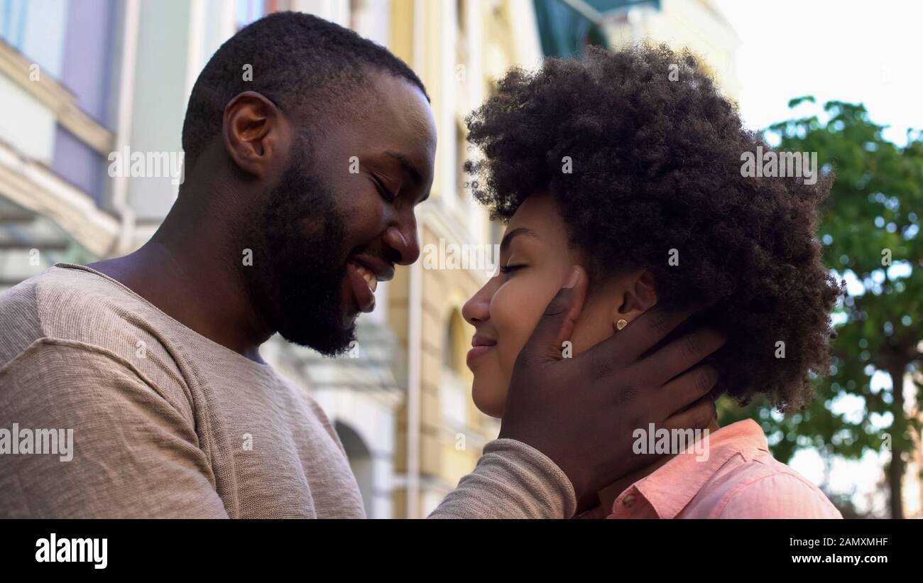 Tender couple nuzzling, relationship of love, feeling safe in boyfriend ...