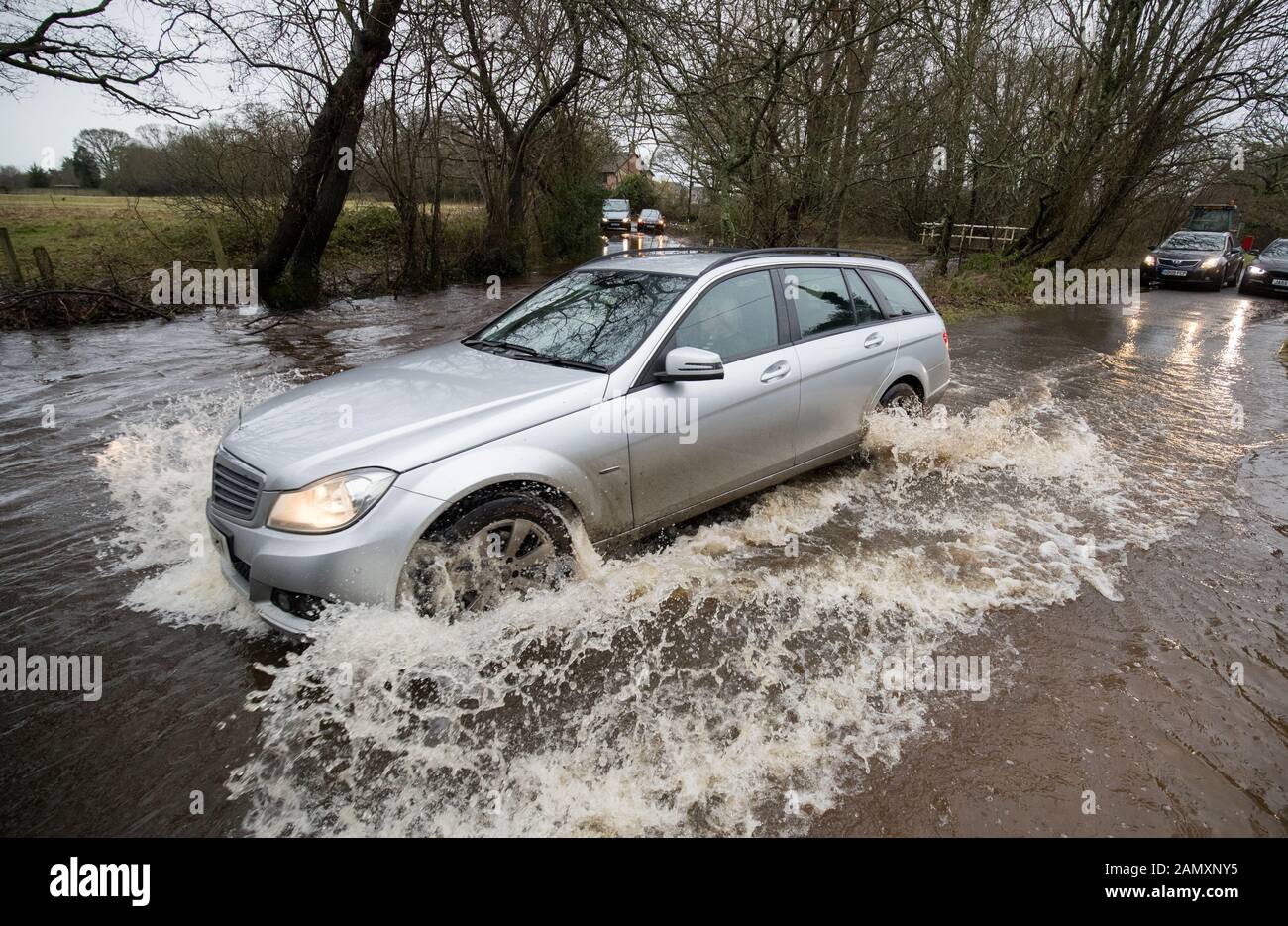 A car makes it's way through a flooded ford near to North Poulner in ...