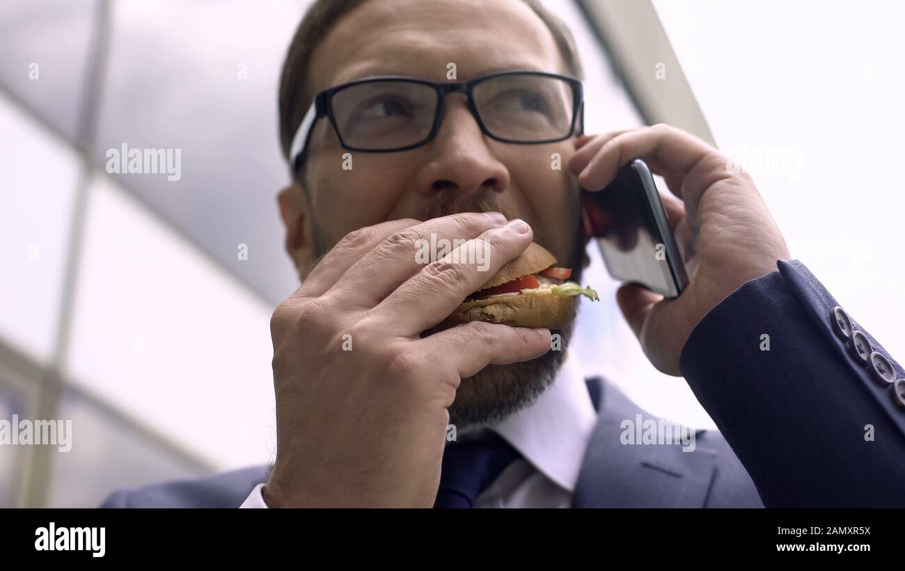 Fat man eating dinner suit hi-res stock photography and images - Alamy