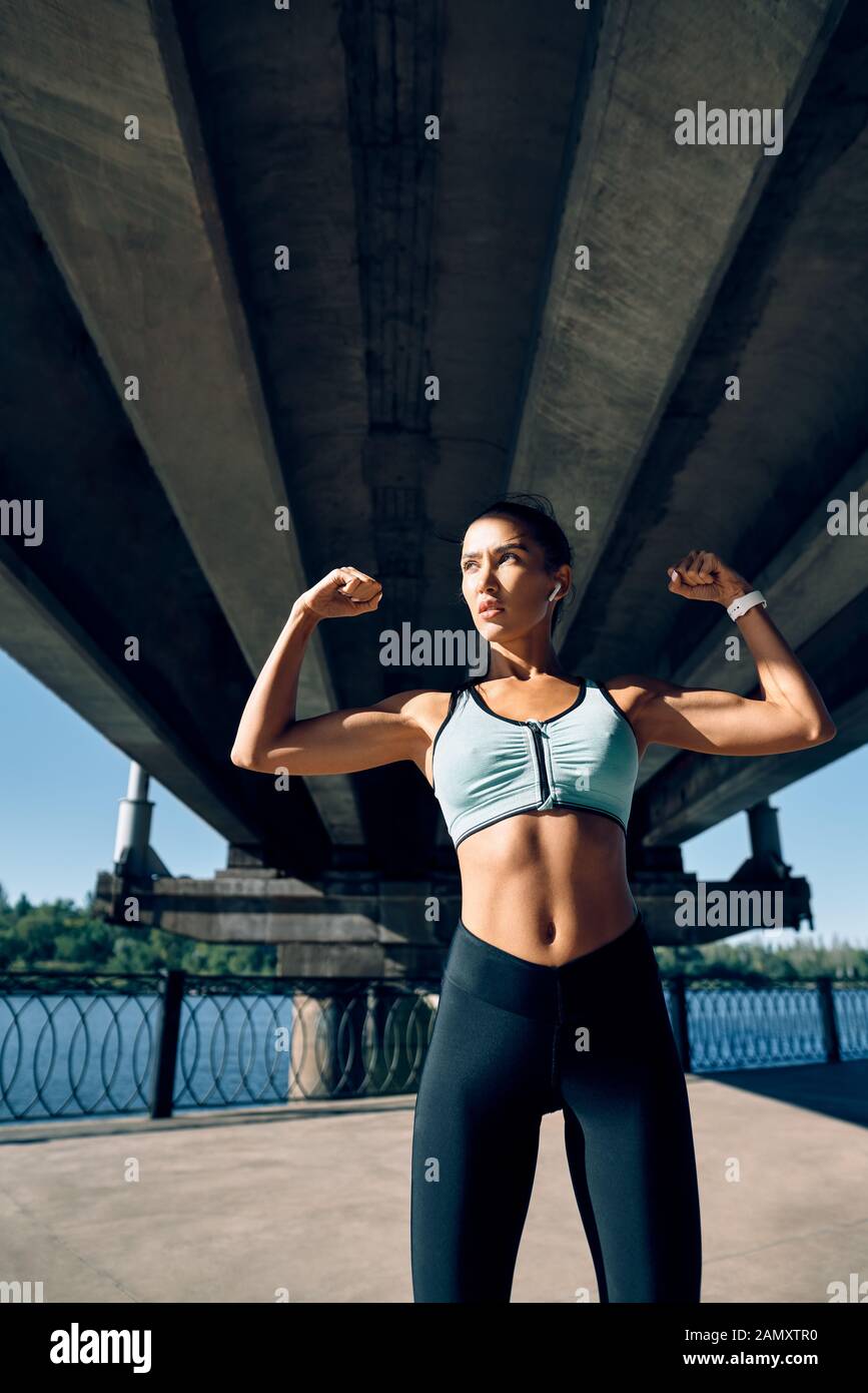 Girl flex muscles hi-res stock photography and images - Alamy
