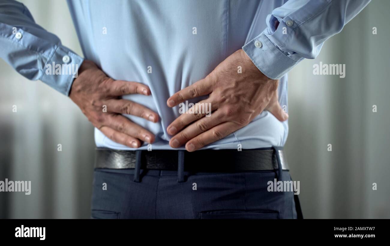 Business person feeling lower back pain, nerves inflammation, kidneys ...