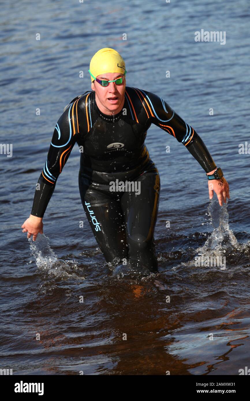 a competitor leaves the water to finish the swim loch lomond open water ...