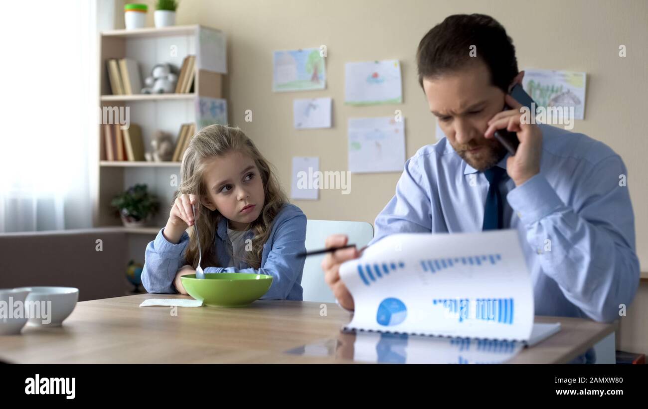 Cute girl need parental attention, father ignoring daughter talking on ...