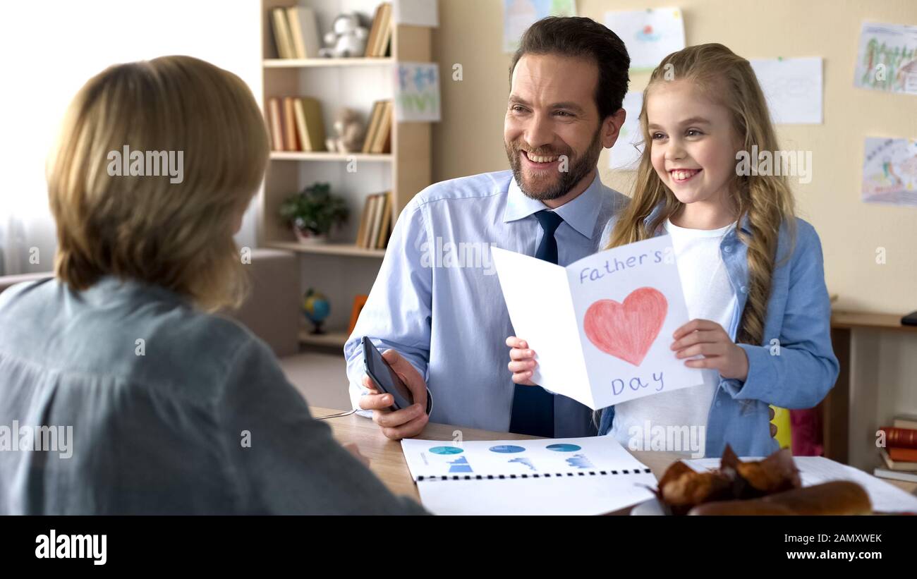 Pleased father rejoicing greeting card from lovely daughter and ...