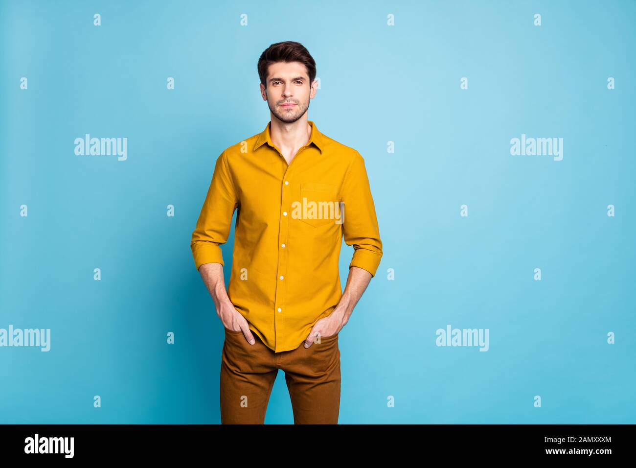 Photo of serious confident sctrict clever manager with hands in pockets ...