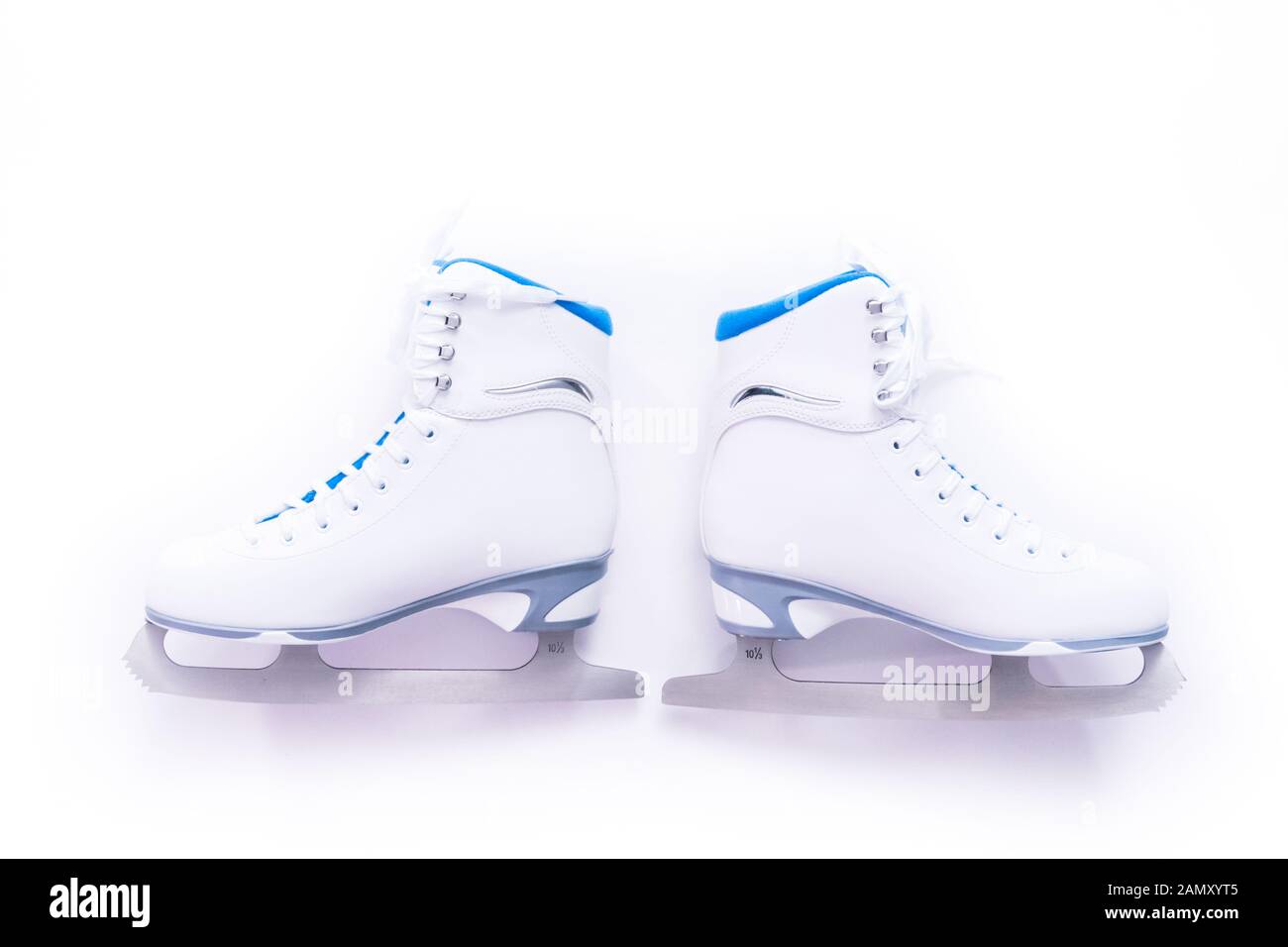 Flat lay. New white figure skates on a white background Stock Photo - Alamy