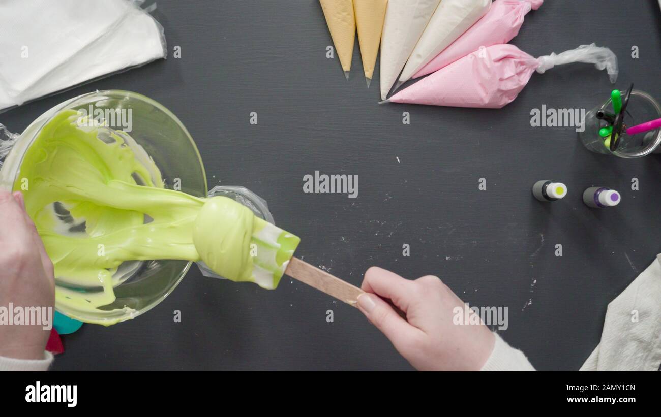 Step by step. Flat lay. Pouring royal icing into the piping bag to ...