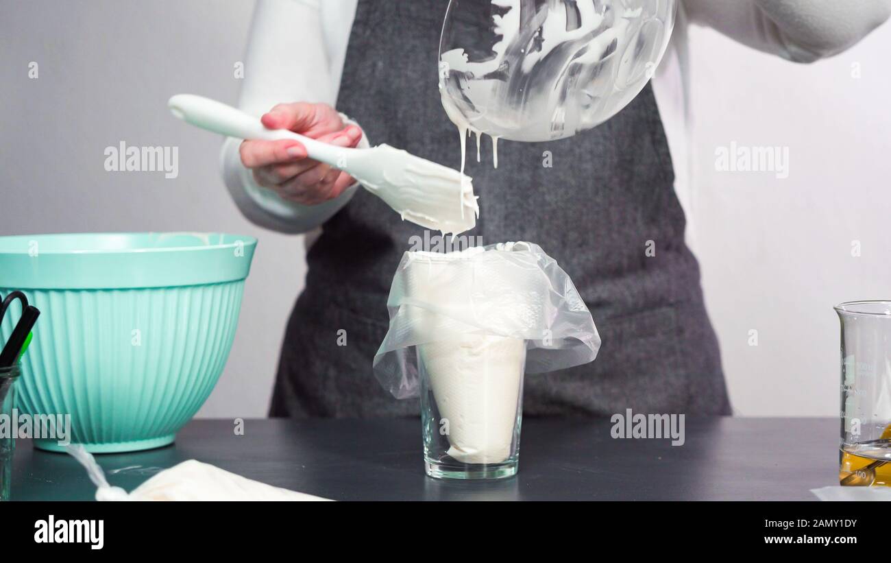 Step by step. Pouring royal icing into the piping bag to decorate sugar ...