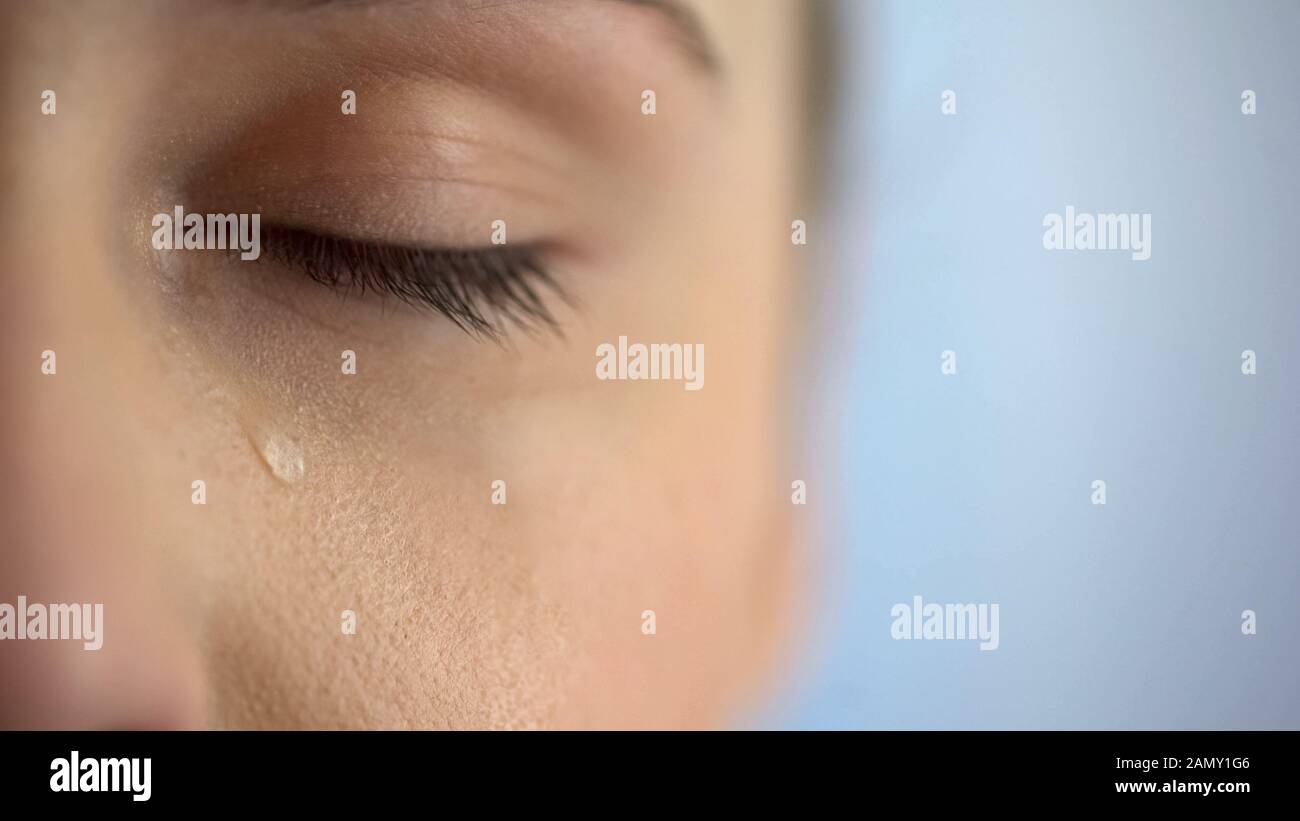Face of unhappy woman crying, closeup eye with teardrops, life problems ...