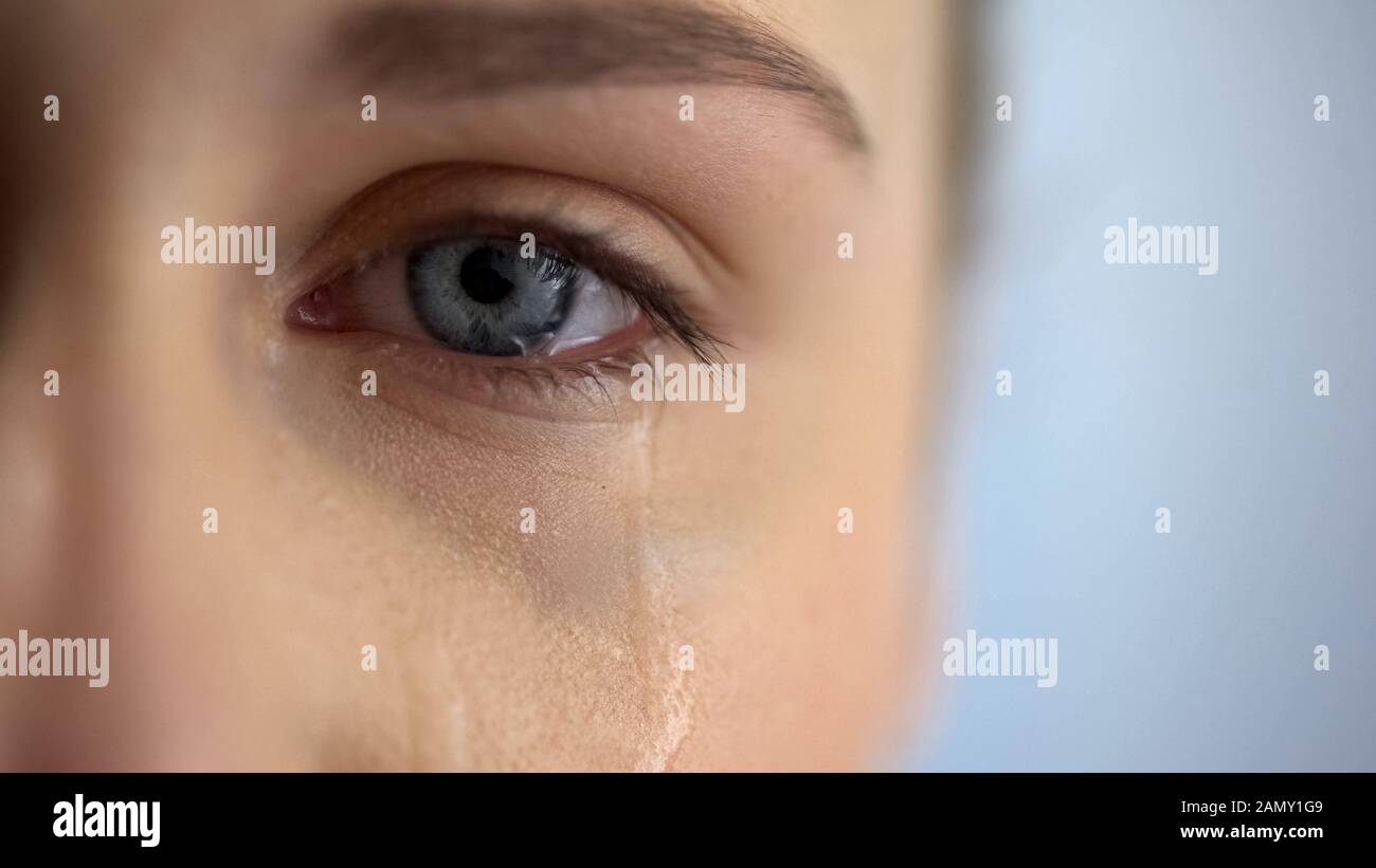 Sad woman crying, suffering pain eyes full of tears, domestic violence ...