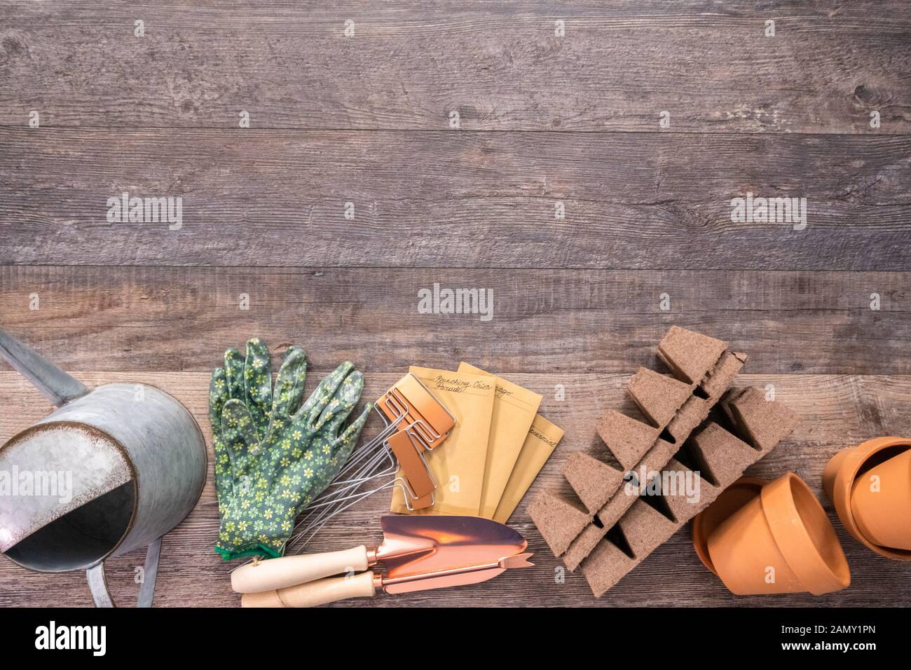 Flat lay. Small garden tools are ready for Spring planting season ...