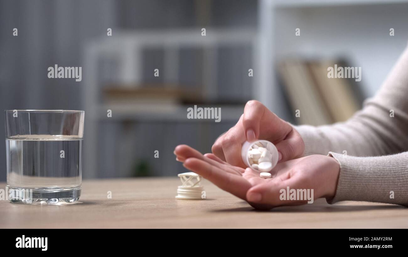 Female taking painkillers, headache or menstrual pain treatment ...