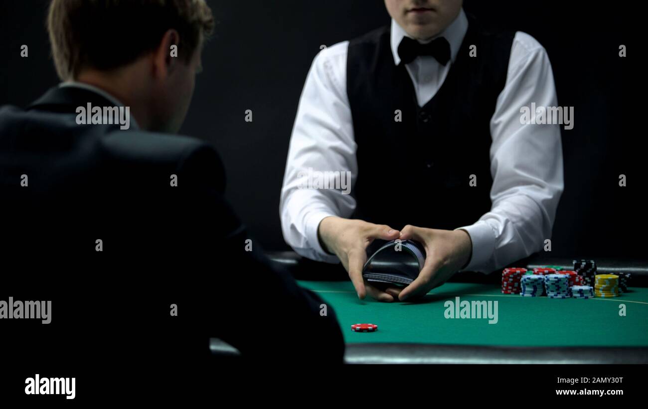 Croupier shuffling cards hi-res stock photography and images - Alamy