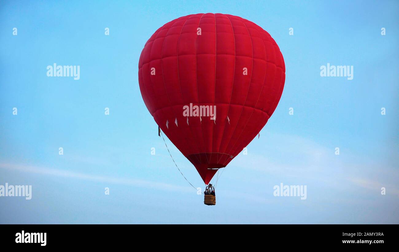 Amazing view of beautiful hot air balloon flying high in sky, extreme ...