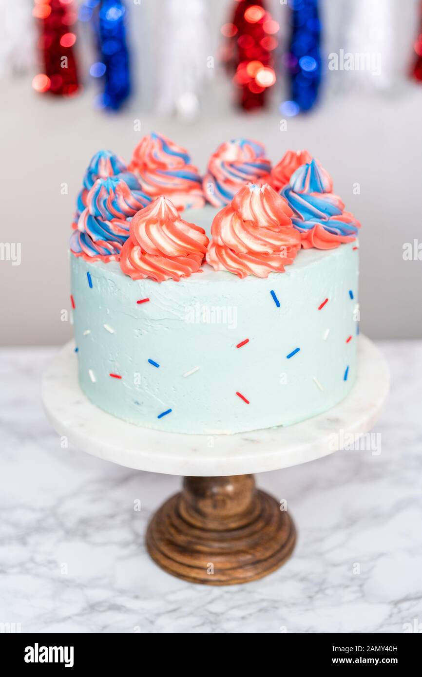 Red, white, and blue round vanilla cake with buttercream frosting for ...