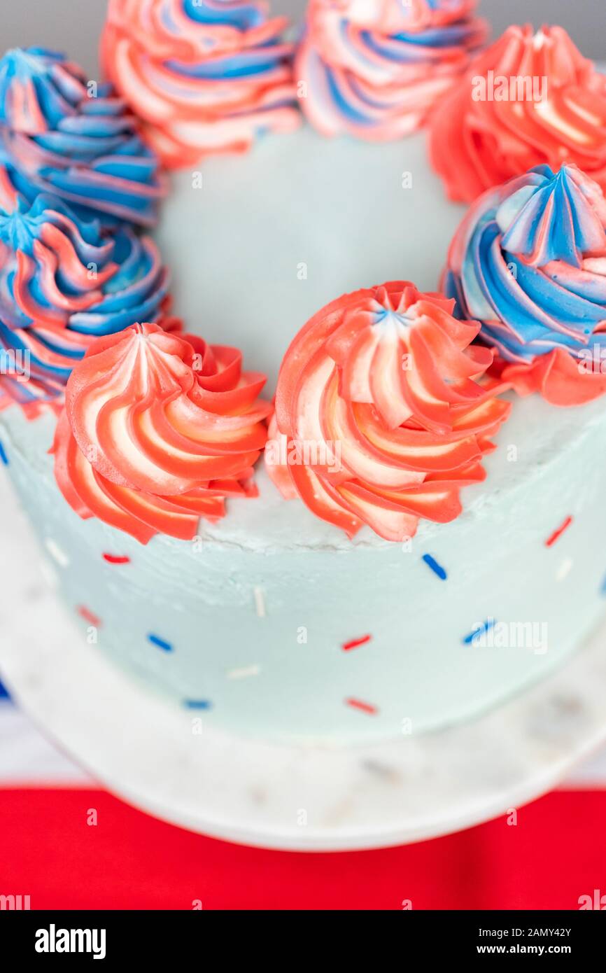 Red, white, and blue round vanilla cake with buttercream frosting for ...
