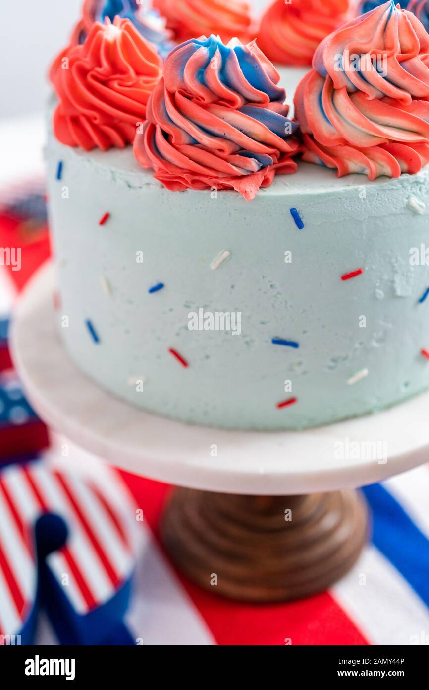 Red, white, and blue round vanilla cake with buttercream frosting for ...