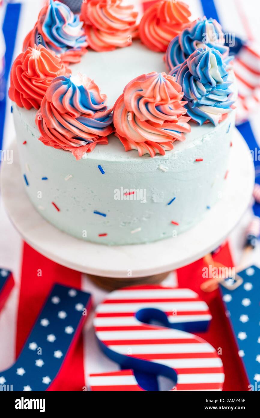 Red, white, and blue round vanilla cake with buttercream frosting for ...