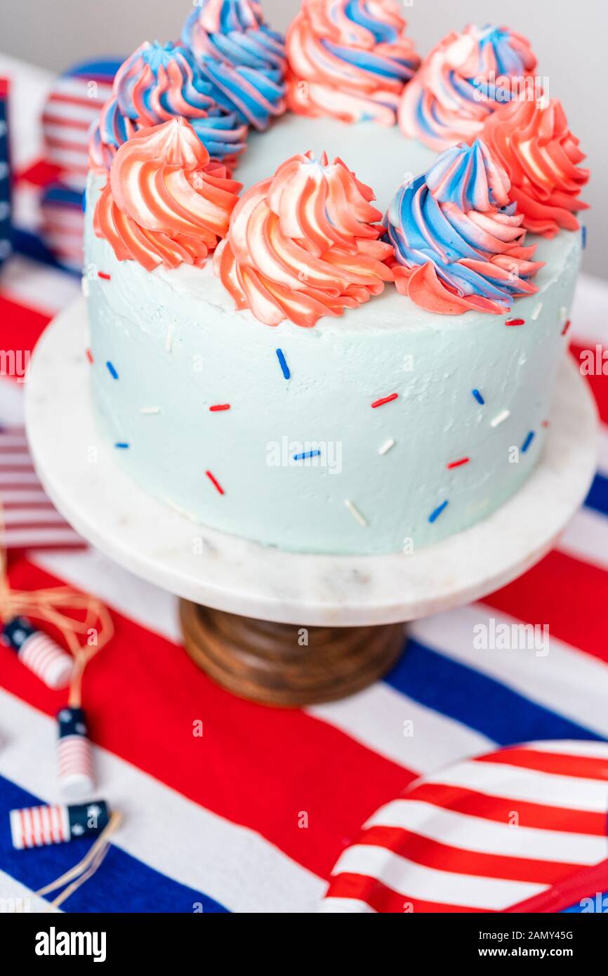 Red, white, and blue round vanilla cake with buttercream frosting for ...