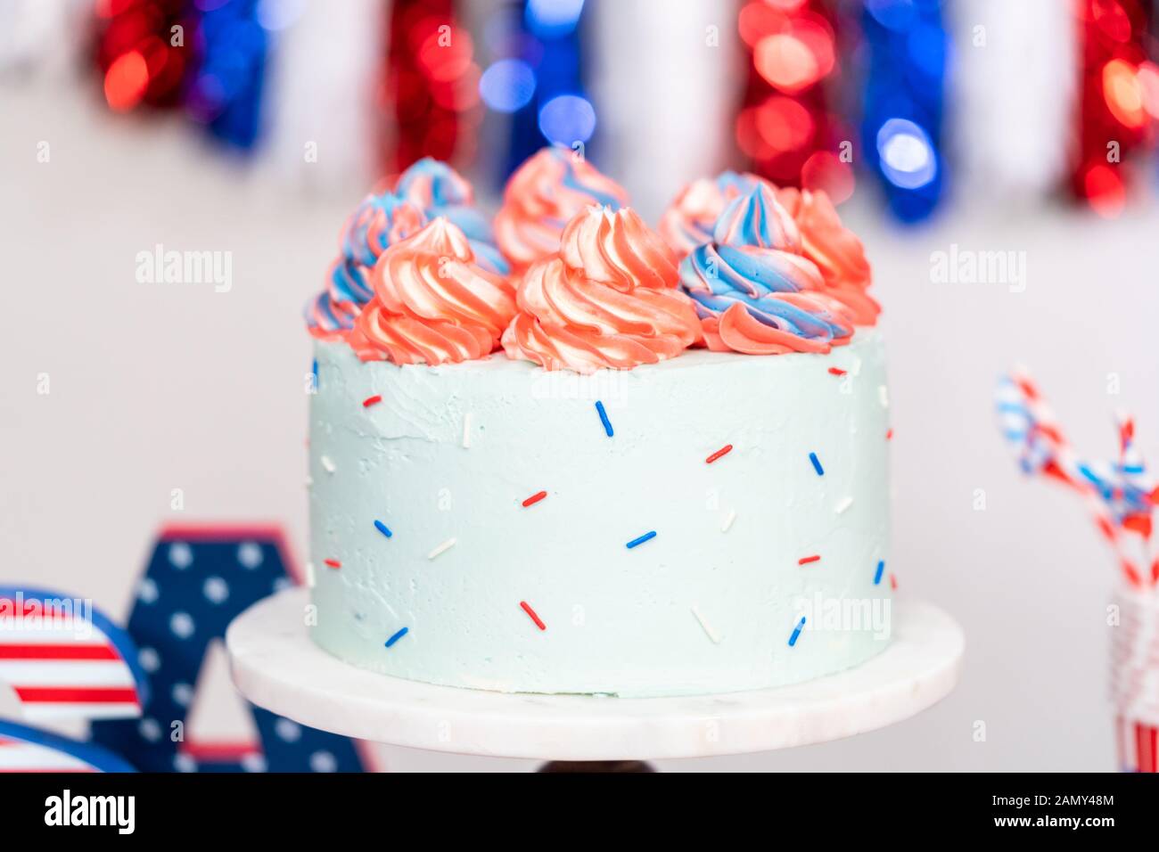 Red, white, and blue round vanilla cake with buttercream frosting for ...