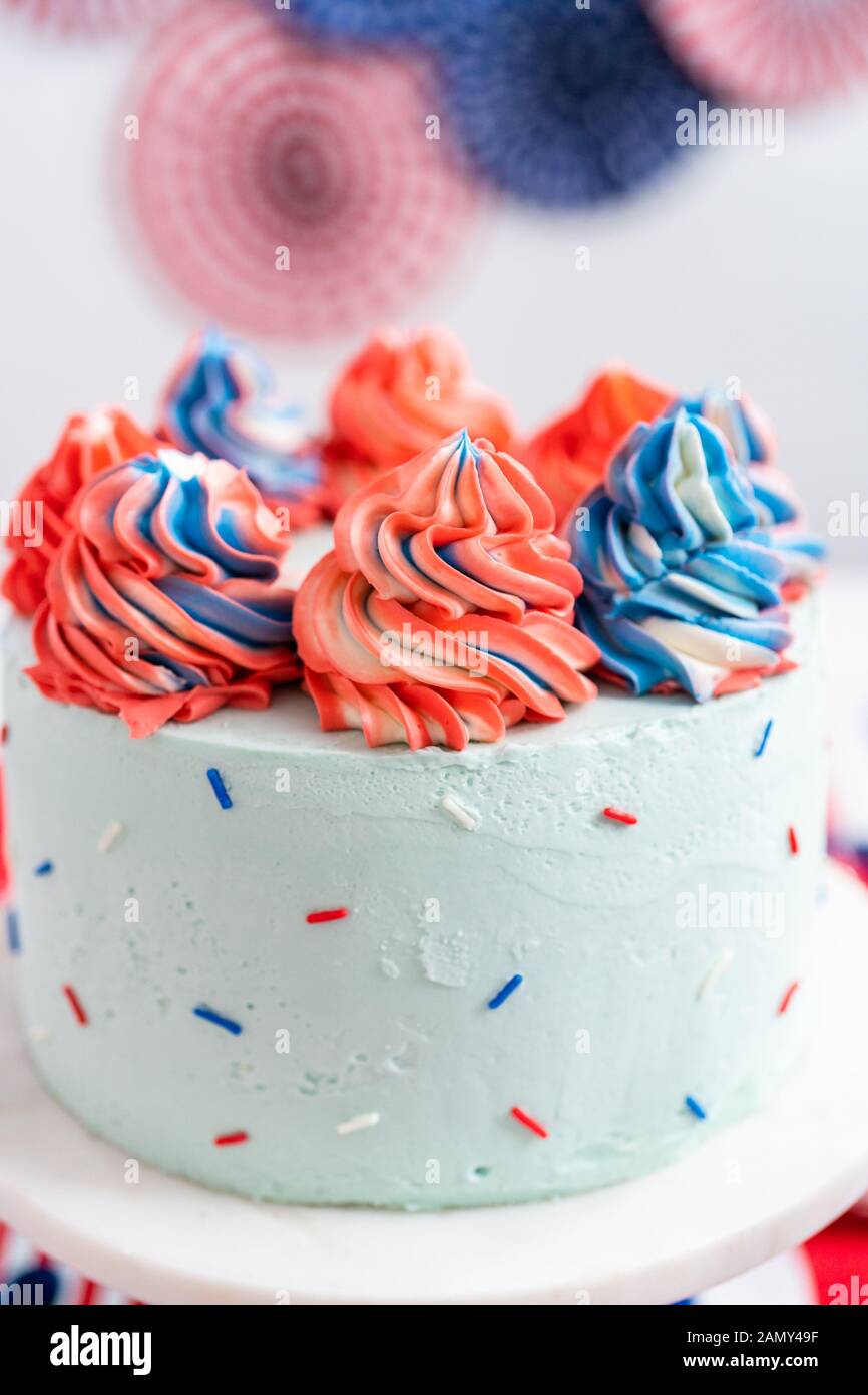 Red, white, and blue round vanilla cake with buttercream frosting for ...