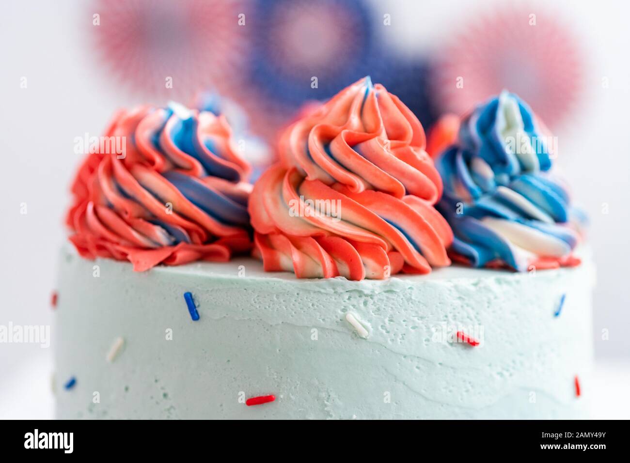 Red, white, and blue round vanilla cake with buttercream frosting for ...