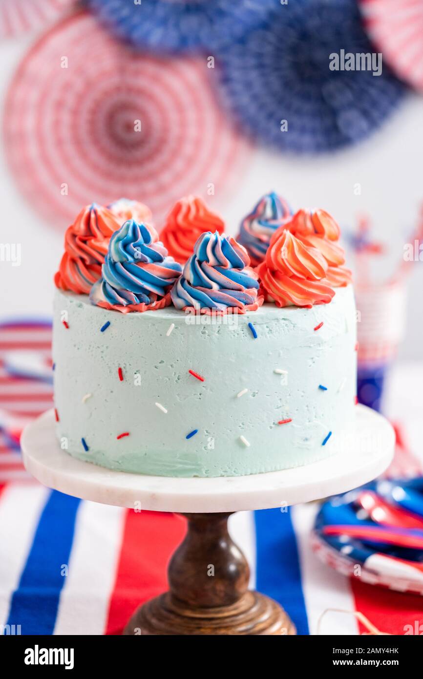 Red, white, and blue round vanilla cake with buttercream frosting for ...