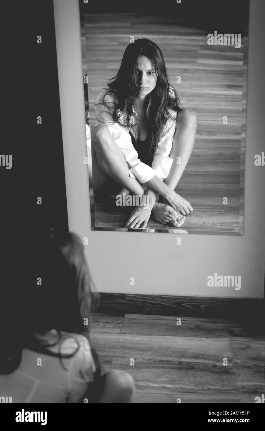 Young woman in front of mirror Black and White Stock Photos & Images ...