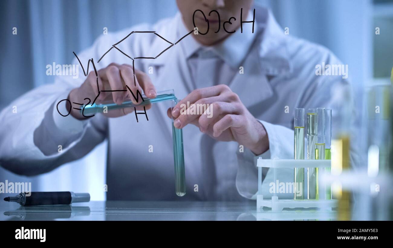 Scientist mixing chemicals hi-res stock photography and images - Alamy