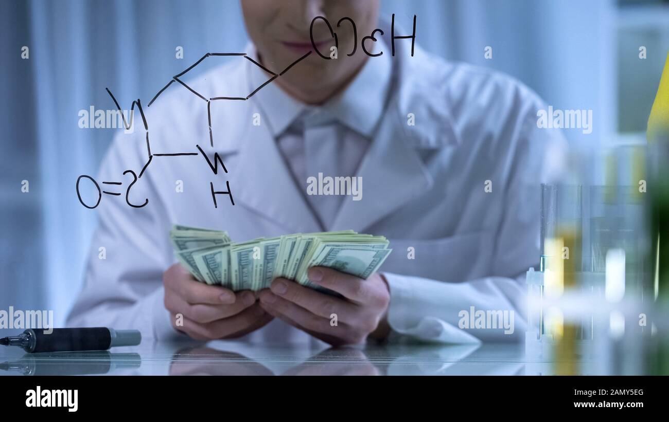 Scientist counting money, financing of research, chemical formula on ...