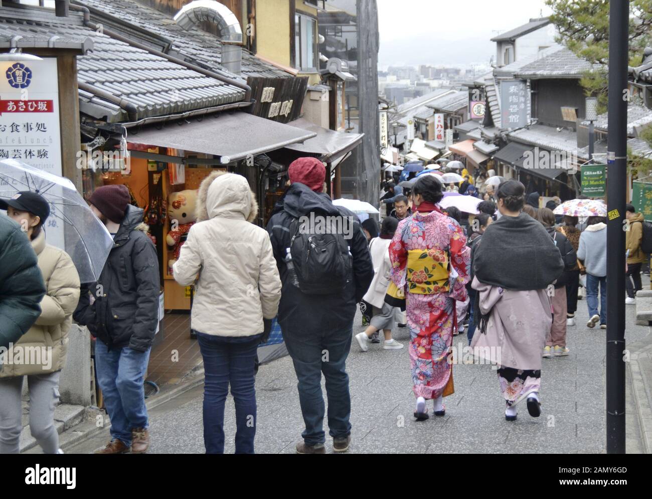 A street near Kyoto's Kiyomizu Temple is crowded with tourists from ...